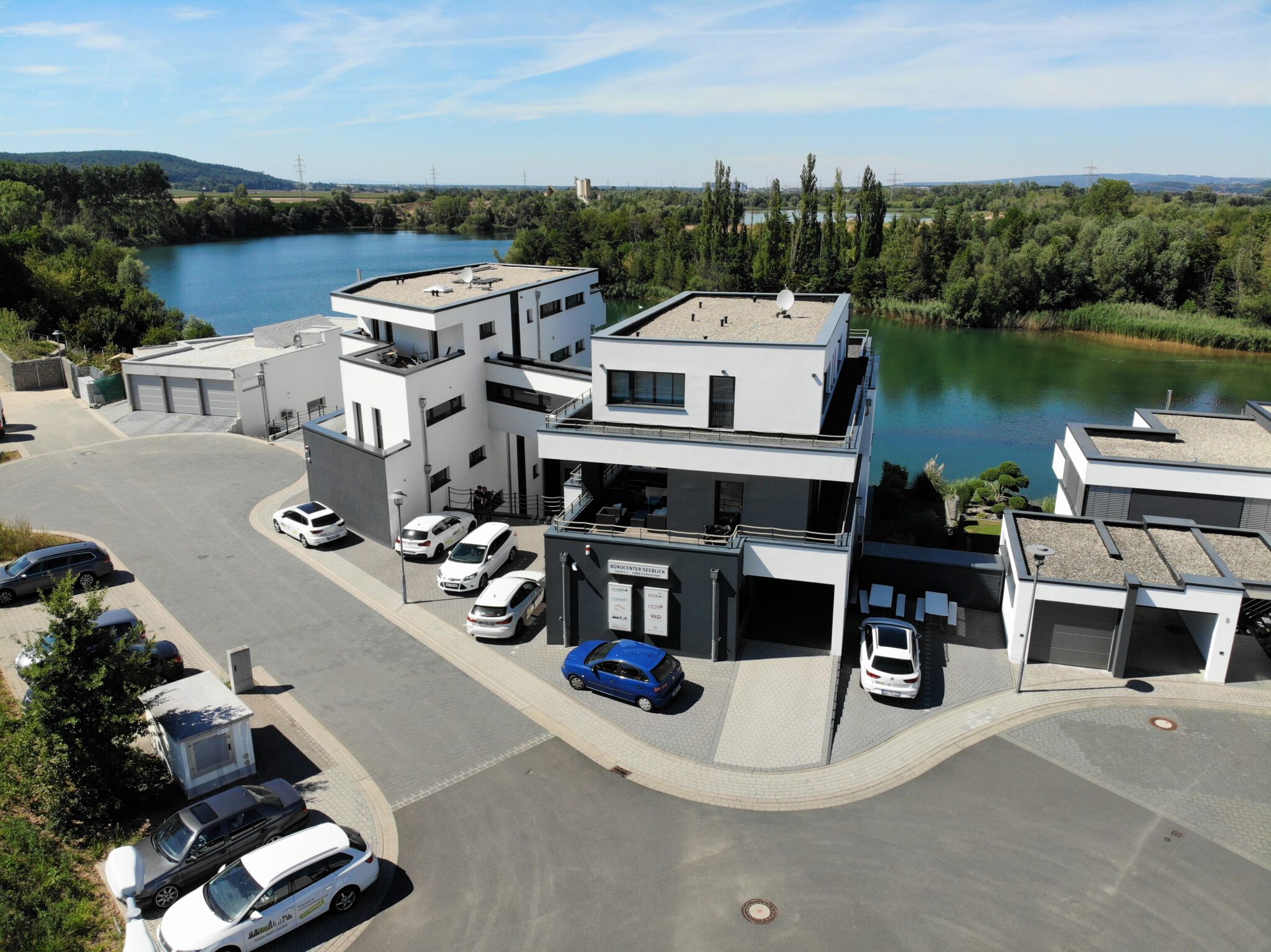 Neubau von zweier Wohn- und Geschäftshäuser an einem Badesee - Tobias G ...